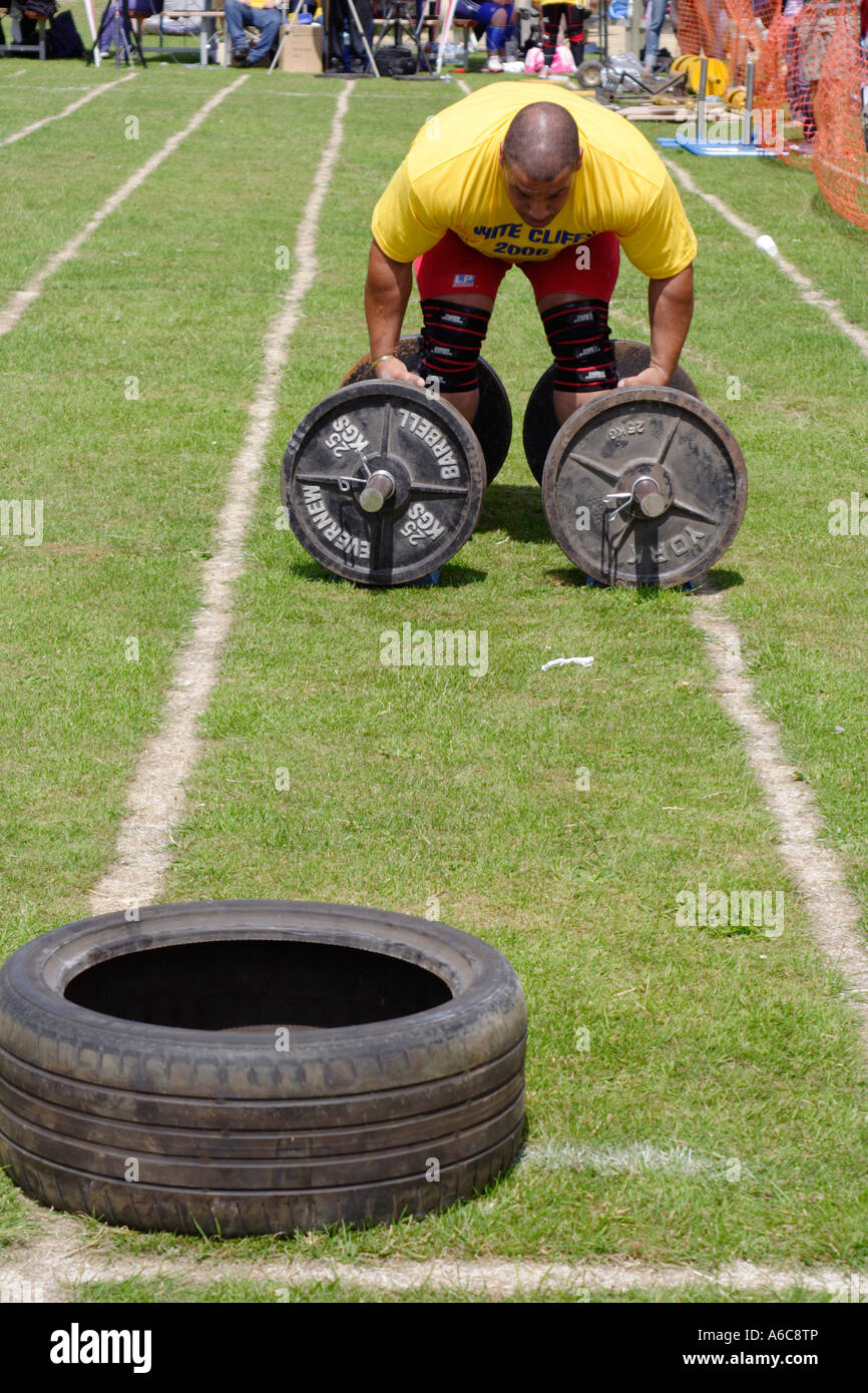 strongman doing the farmers walk Stock Photo - Alamy