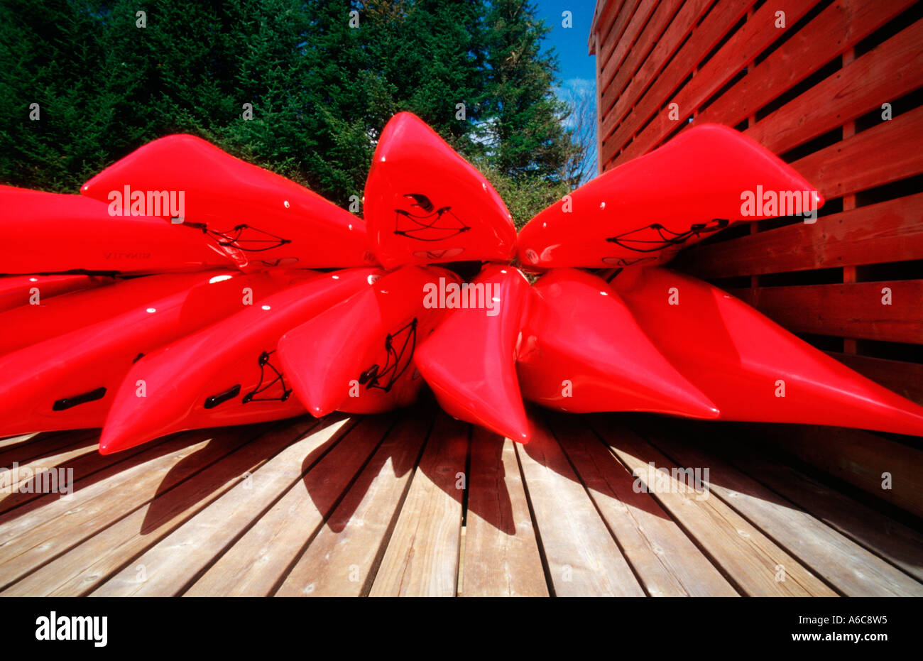Red plastic canoes Stock Photo - Alamy