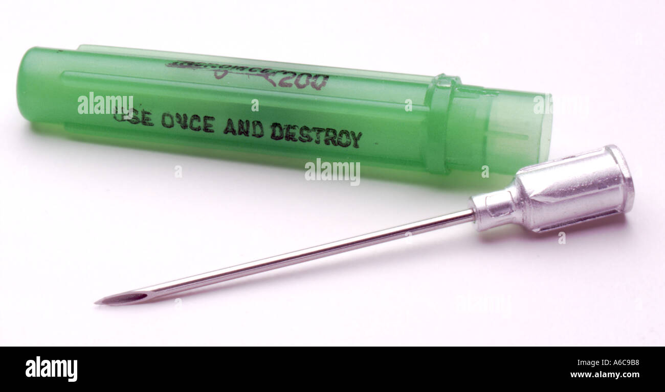 Needle with safety cap Stock Photo - Alamy