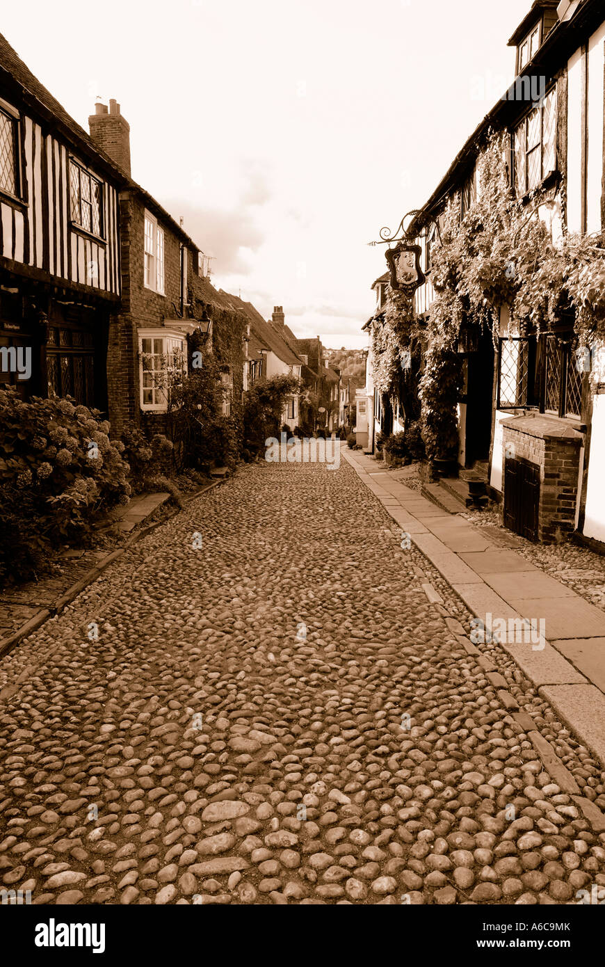 Historic wooden framed building on the streets of Rye East Sussex sepia ...