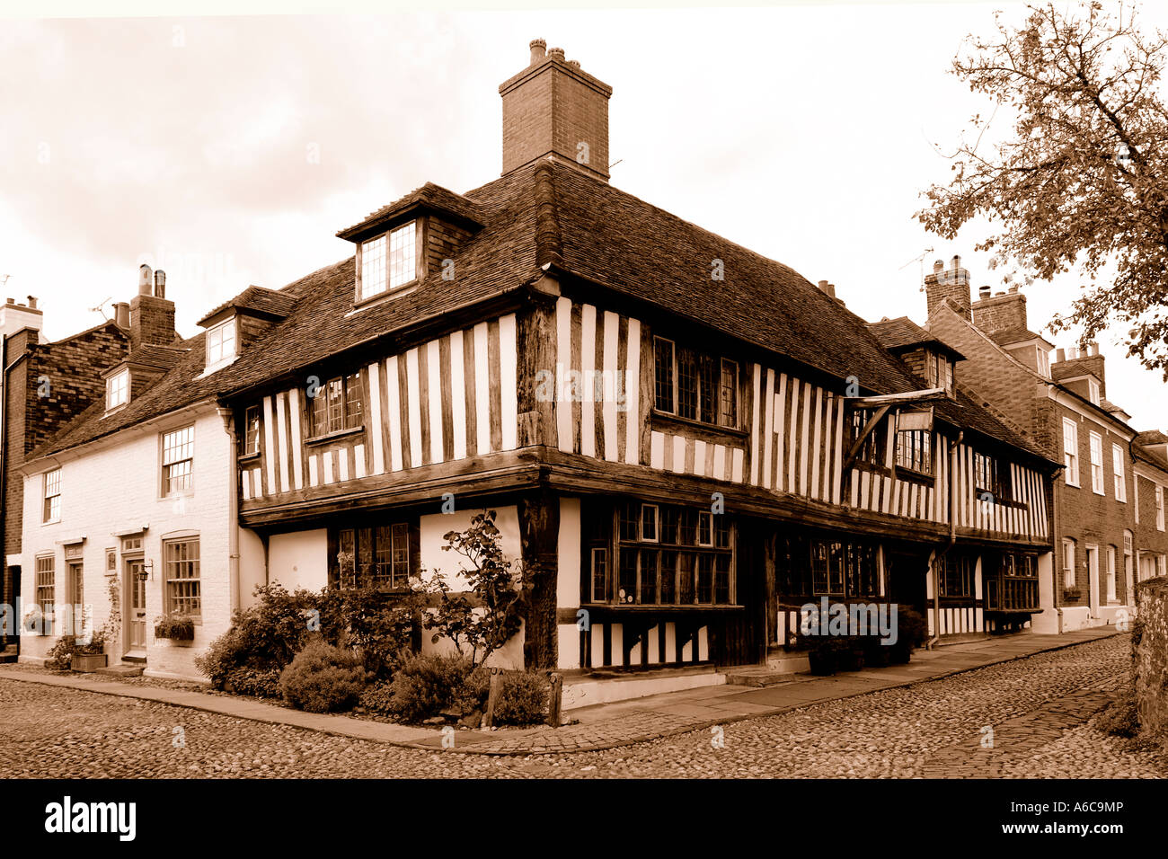 Historic wooden framed building on the streets of Rye East Sussex sepia ...