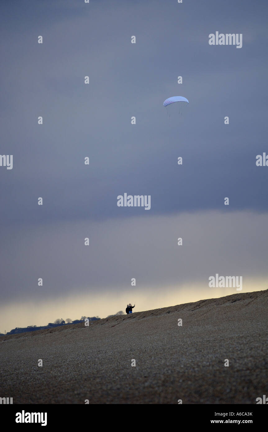Kite flying and approaching storm Hythe beach Kent UK Stock Photo - Alamy