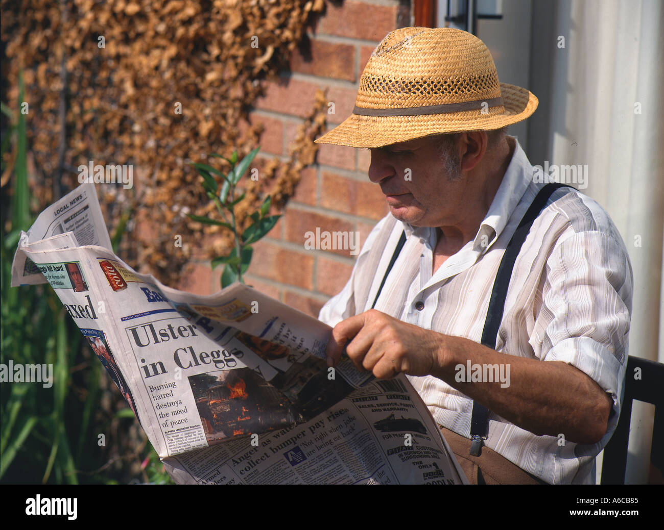 Elderly man reading Newspaper Stock Photo - Alamy