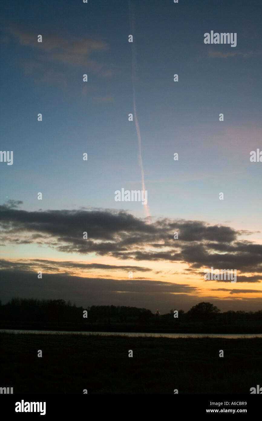Aircraft Trail in the Sky and Sunset Stock Photo - Alamy