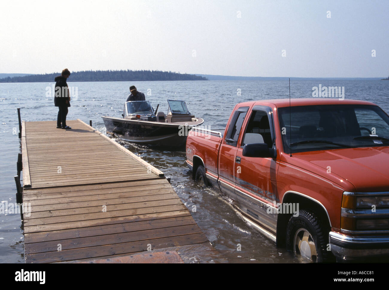Loading the boat Stock Photo - Alamy