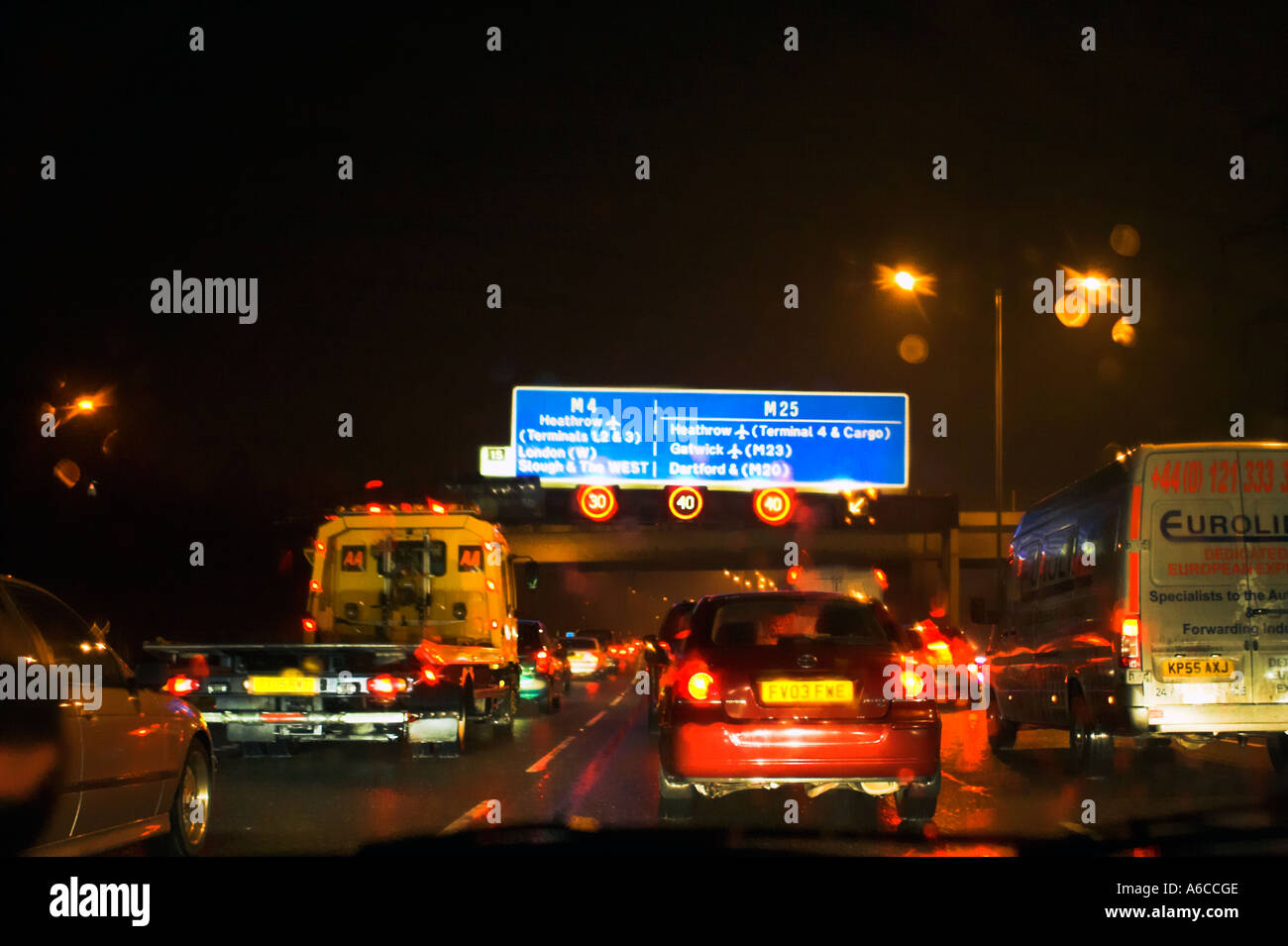 M-25 Motorway in a rainy night, Traffic Jam, London Orbital, England ...
