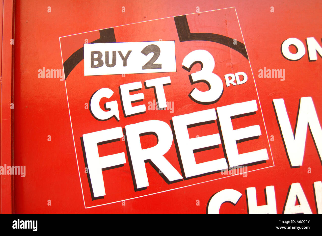 Red buy two get third free sign Stock Photo - Alamy