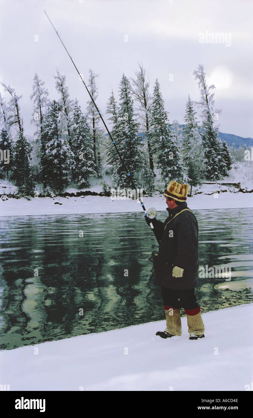 Altai native man is fishing Stock Photo - Alamy