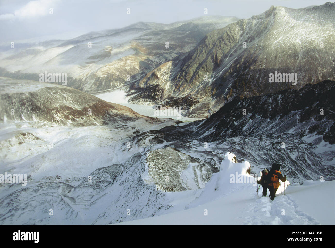 A group of climbers is tracking on the mountain range Stock Photo - Alamy