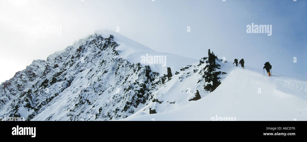 A group of climbers is tracking on the mountain range Stock Photo - Alamy