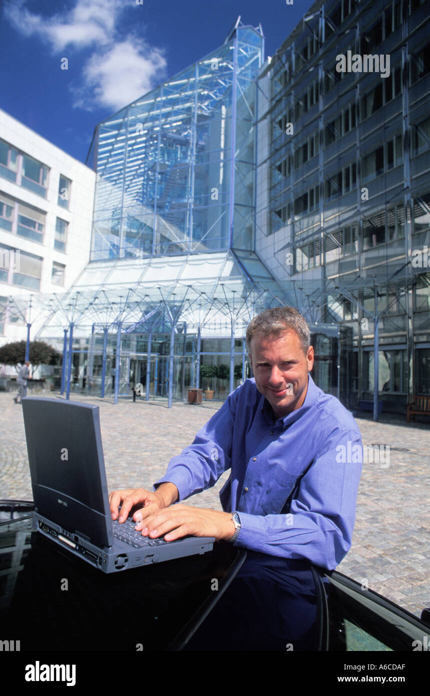 BUSINESS MAN WITH A LAPTOP MODEL RELEASED Stock Photo - Alamy