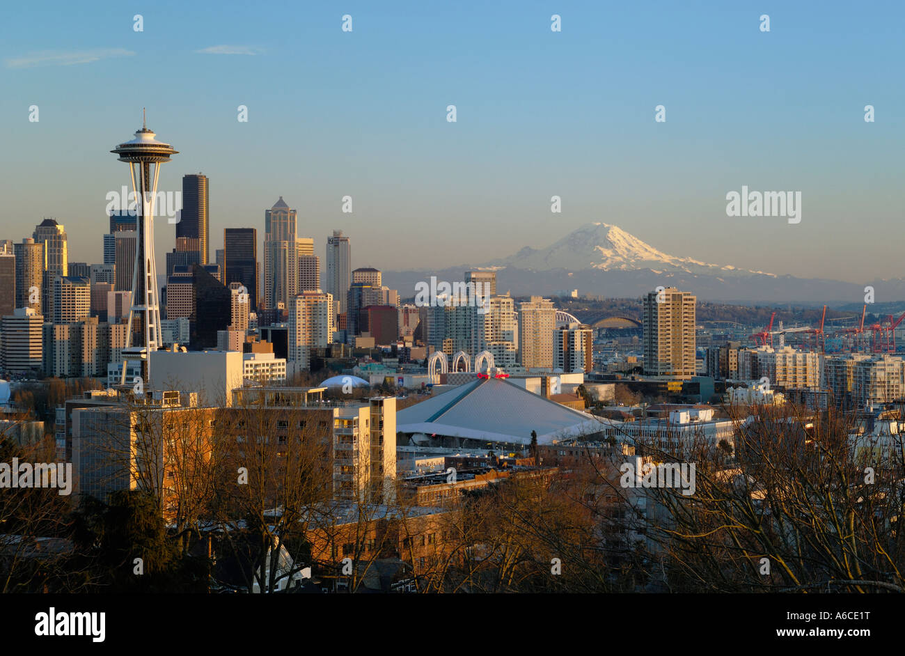 City skyline at sunset with the Space Needle downtown and Mount Hood ...