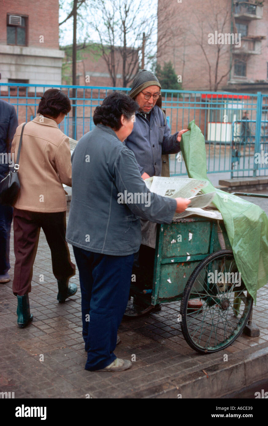 Beijing newspaper seller Stock Photo - Alamy