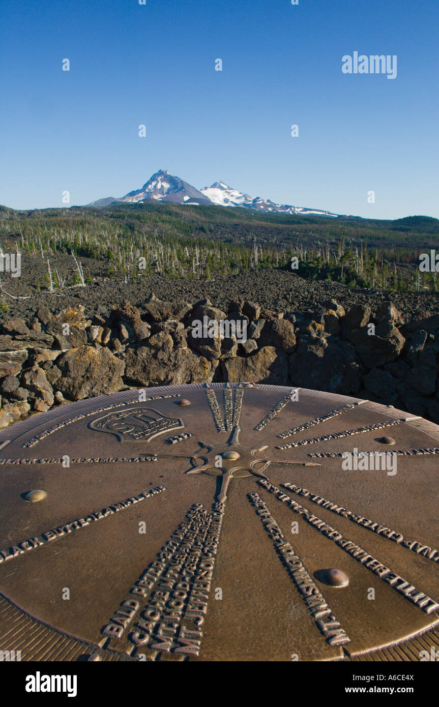 Directional plaque and Sisters mountain peaks at Dee Wright Observatory ...