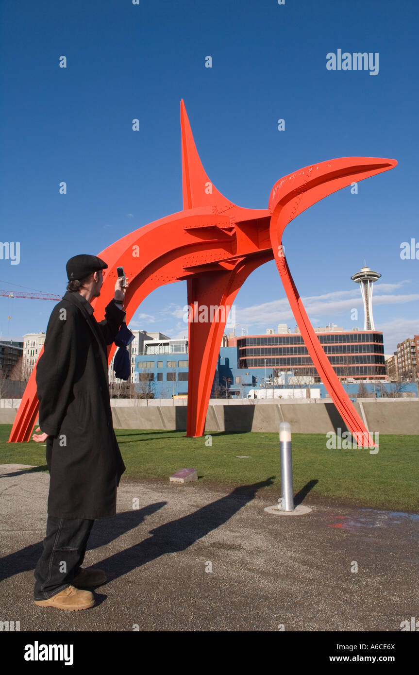 Visitor taking photo with cell phone of Alexander Calders Eagle at ...