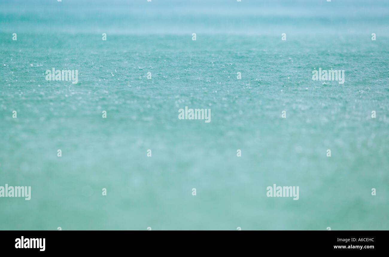 Rain falling on water during a monsoon Thailand Stock Photo - Alamy