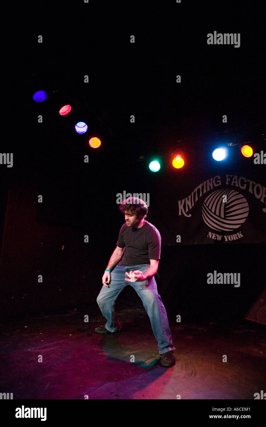 Performers appear on stage in an Air Guitar competition in New York ...