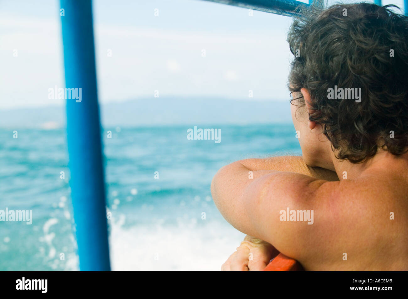Man riding a boat in the Gulf of Thailand Stock Photo - Alamy