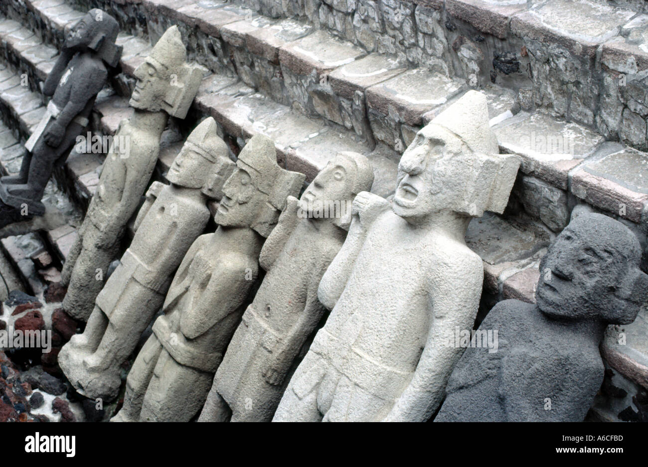 Aztec statues resting against the pyramid of Teotitlan or Templo Mayor ...