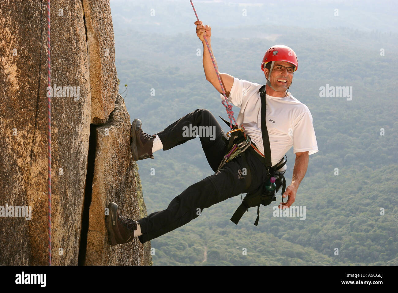 a man climbing Stock Photo - Alamy