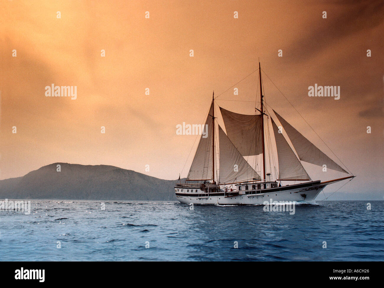 Traditional east Mediterranean sailing boat under full sail off Hydra ...