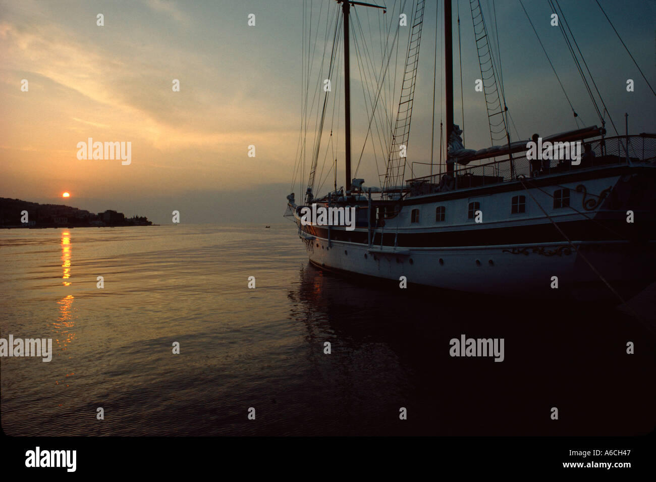 Sunset in harbour of Spetsai Greek islands Stock Photo - Alamy