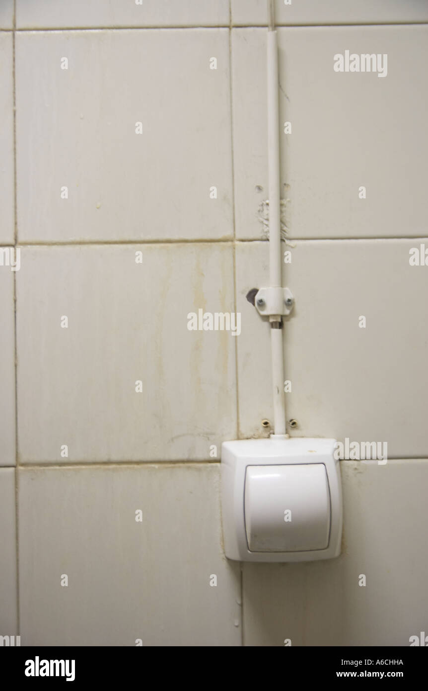 Tumbler switch on a white wall Stock Photo - Alamy