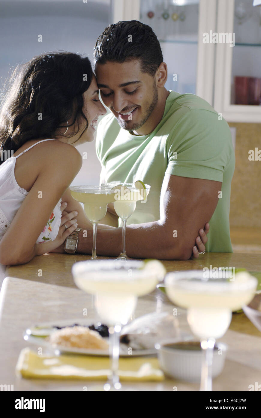 Side profile of a young couple being romantic Stock Photo - Alamy