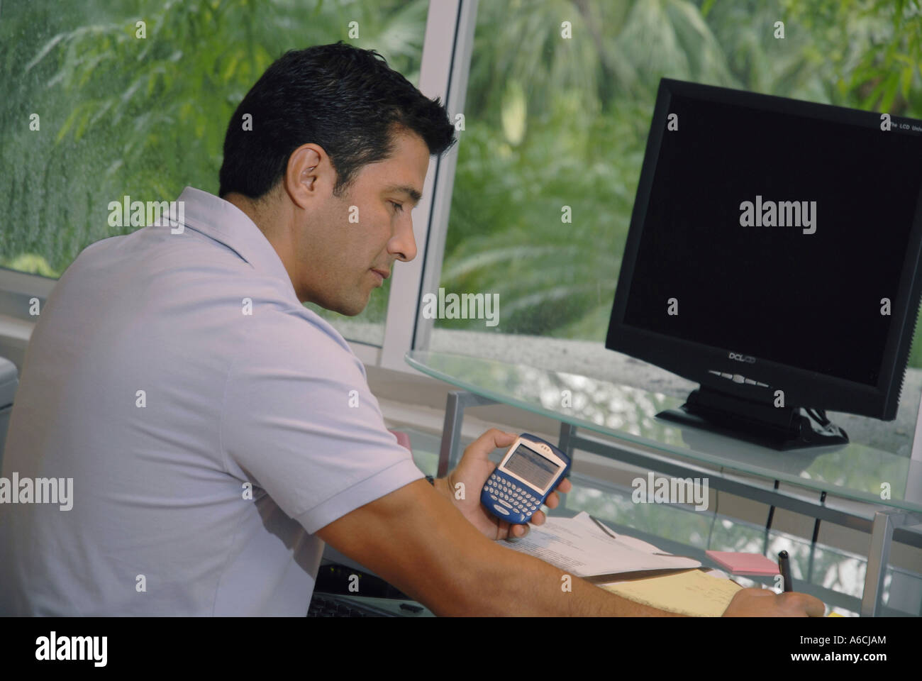 Side profile of a businessman sitting in front of a computer Stock ...