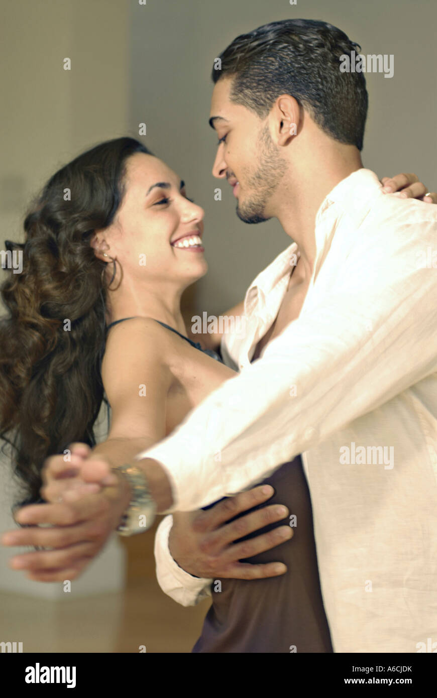Side profile of a young couple dancing the tango Stock Photo - Alamy