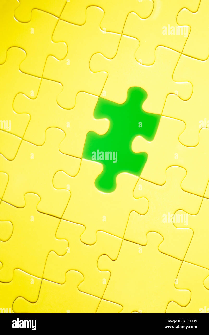 One puzzle piece missing from yellow puzzle, still life Stock Photo - Alamy