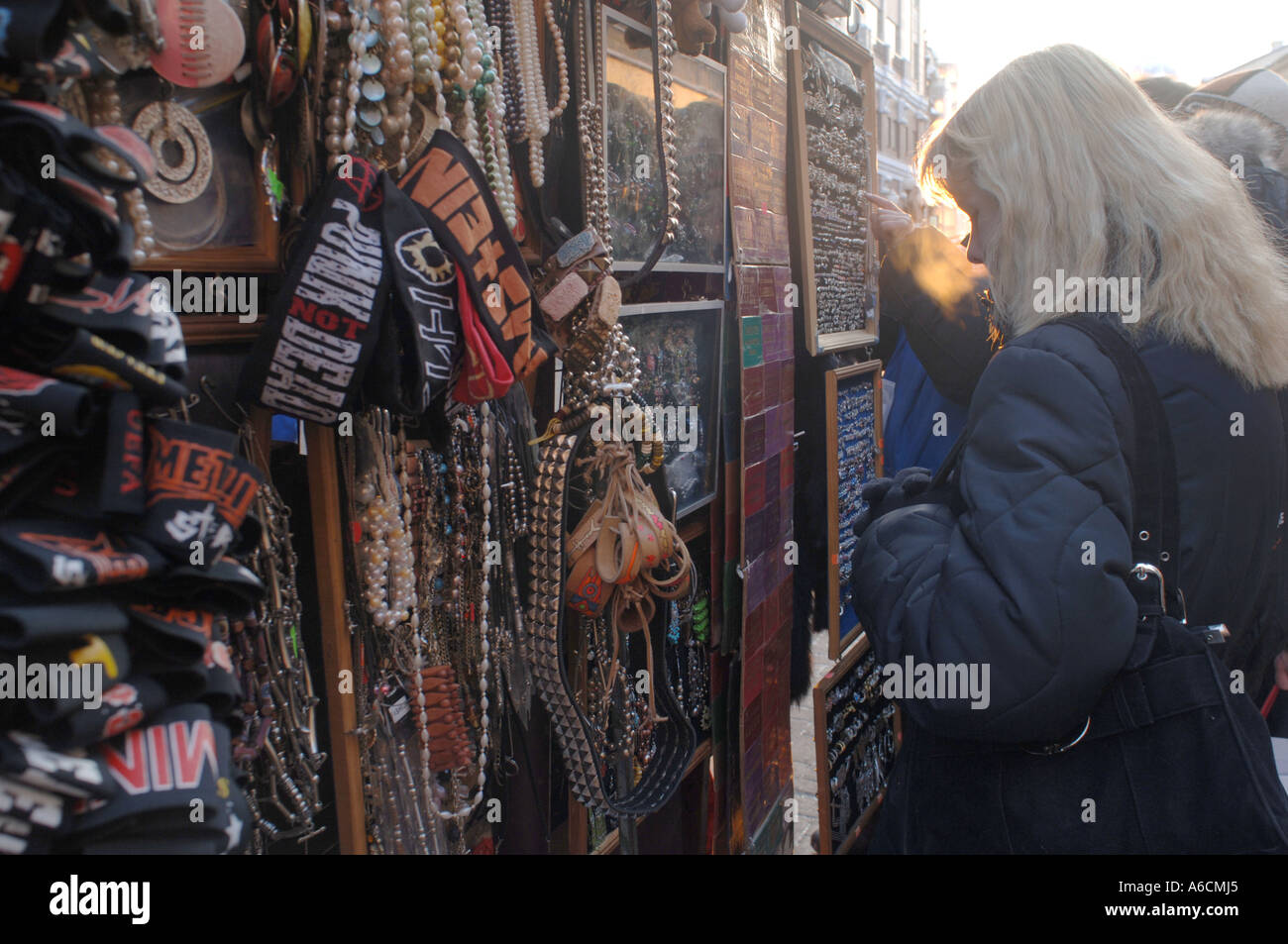 Girl inspecting souvenirs for sale on Stary Arbat - the Old Arbat - in ...