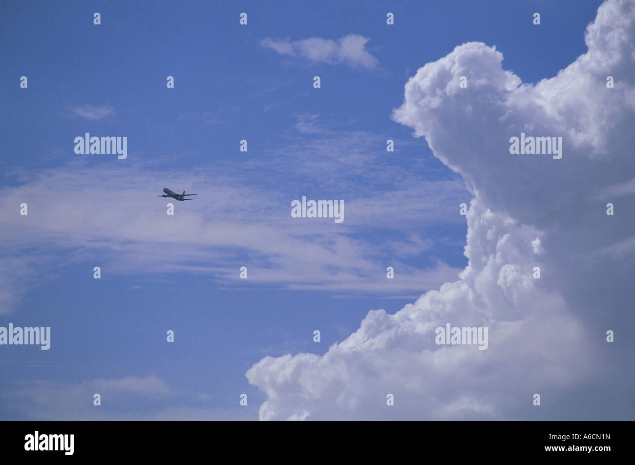 Airplane flying in the sky Stock Photo - Alamy