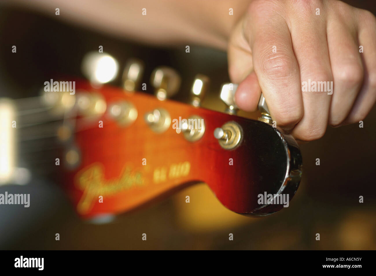 Person tuning the guitar Stock Photo - Alamy