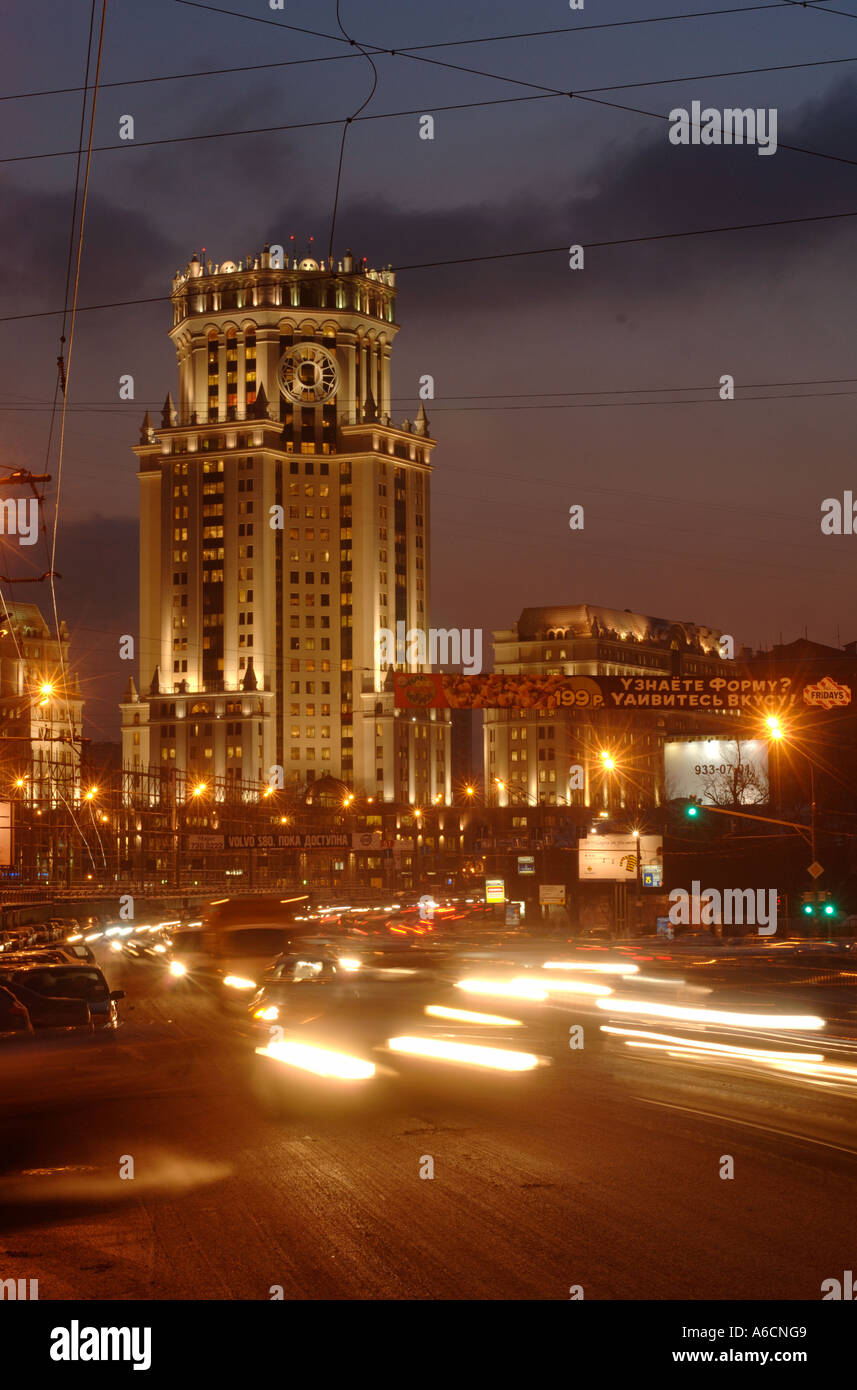 Traffic rushing passed a newly built modern office skyscraper in Moscow ...