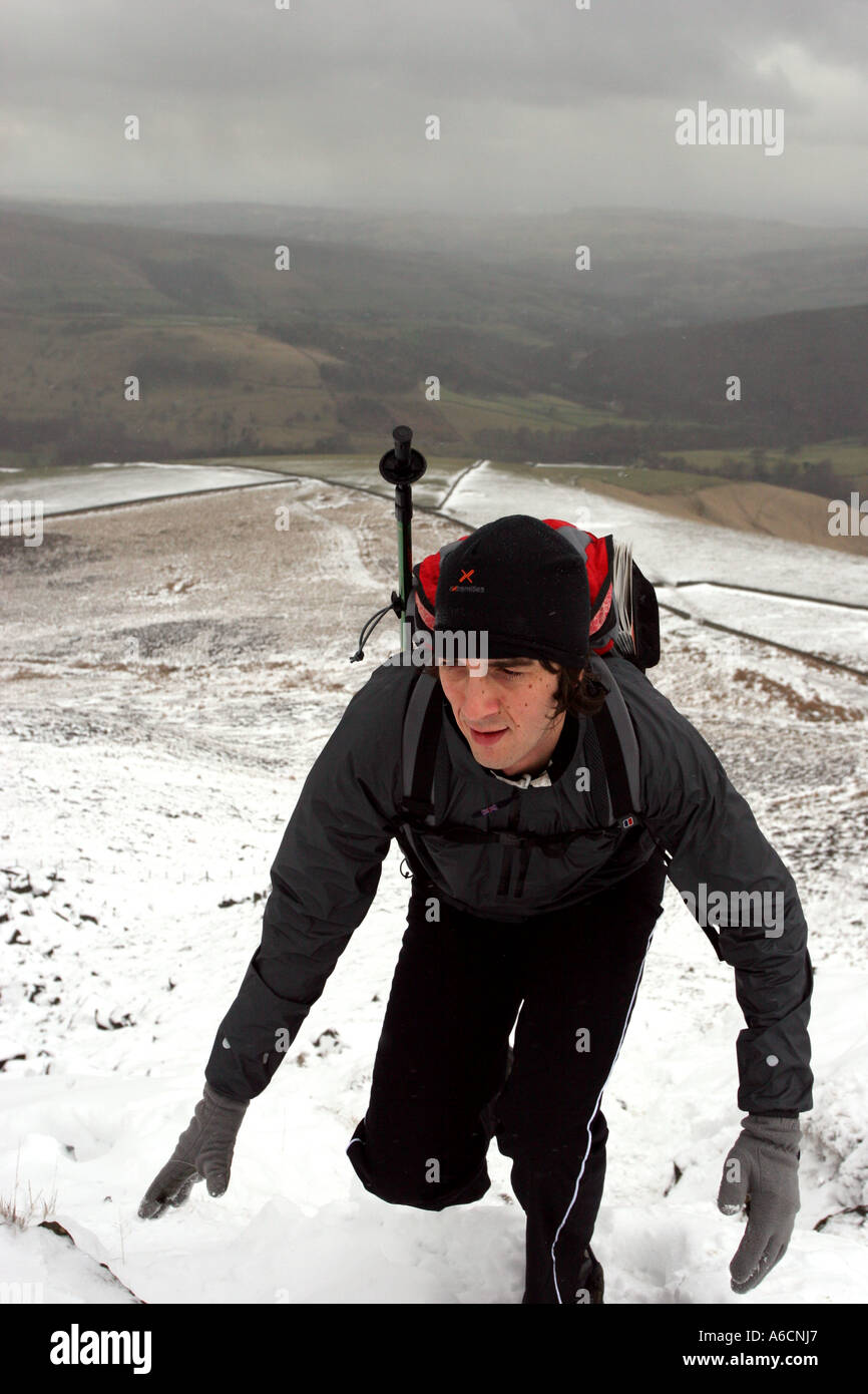 Scrambling up a Kinder Scout in the snow Stock Photo - Alamy