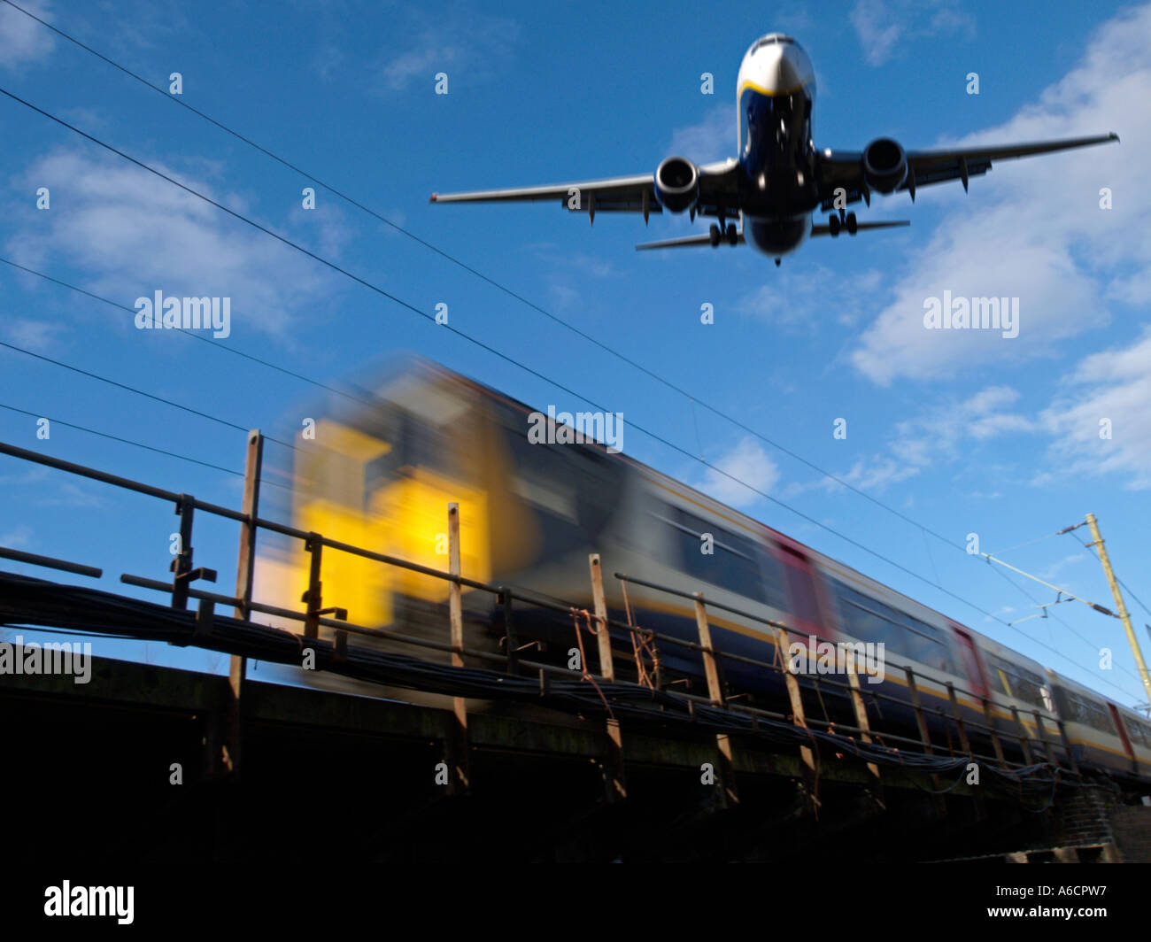 Plane flying over train hi-res stock photography and images - Alamy