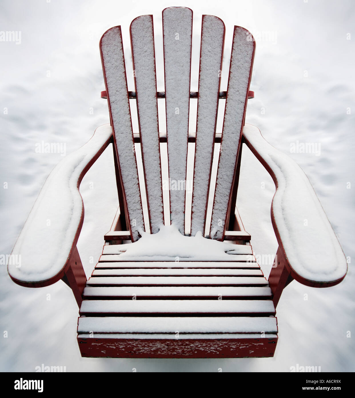 Snow Covered Adirondack Chair Stock Photo - Alamy
