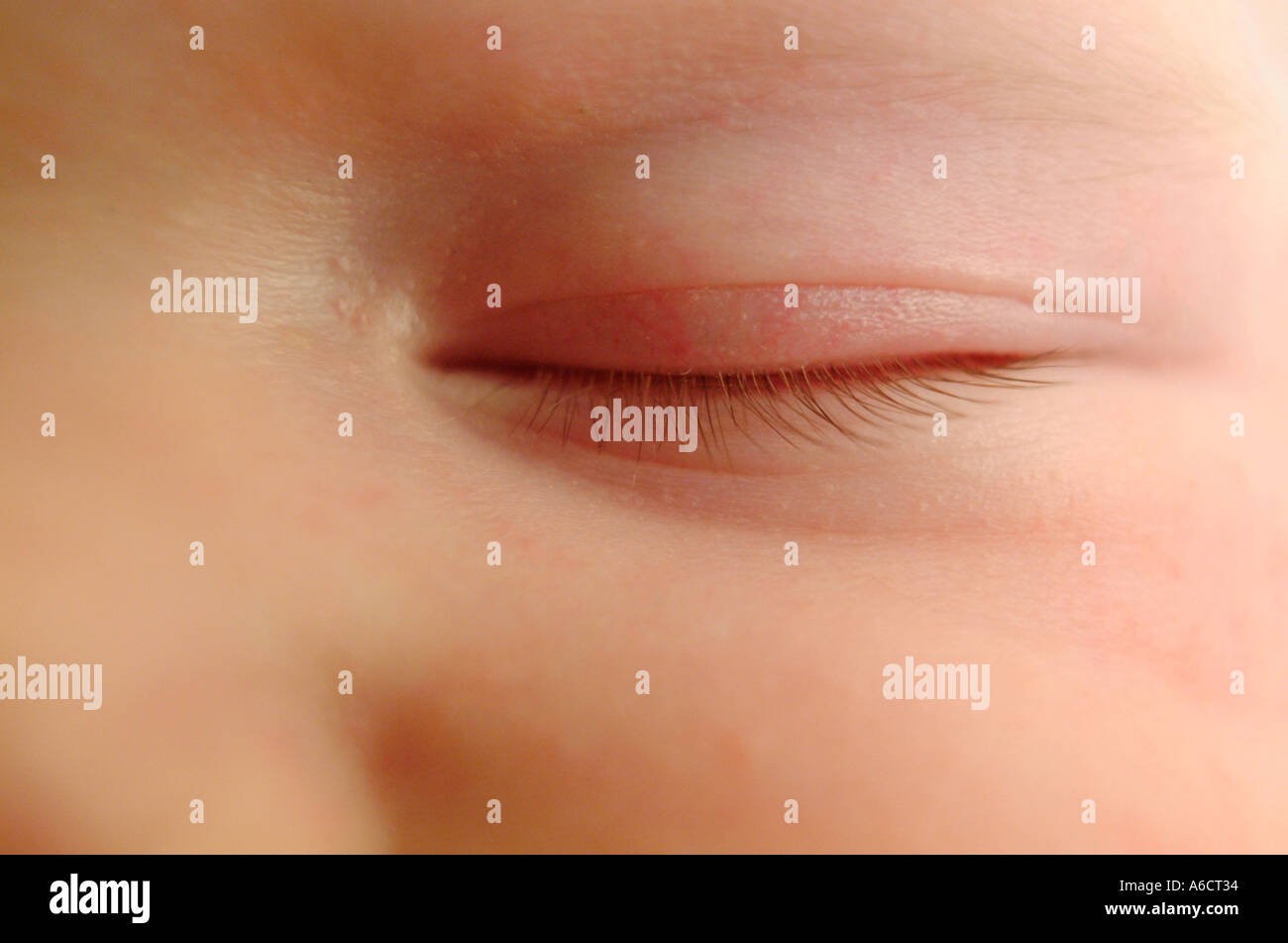 Closed eye on the face of a sleeping baby boy MR Stock Photo - Alamy