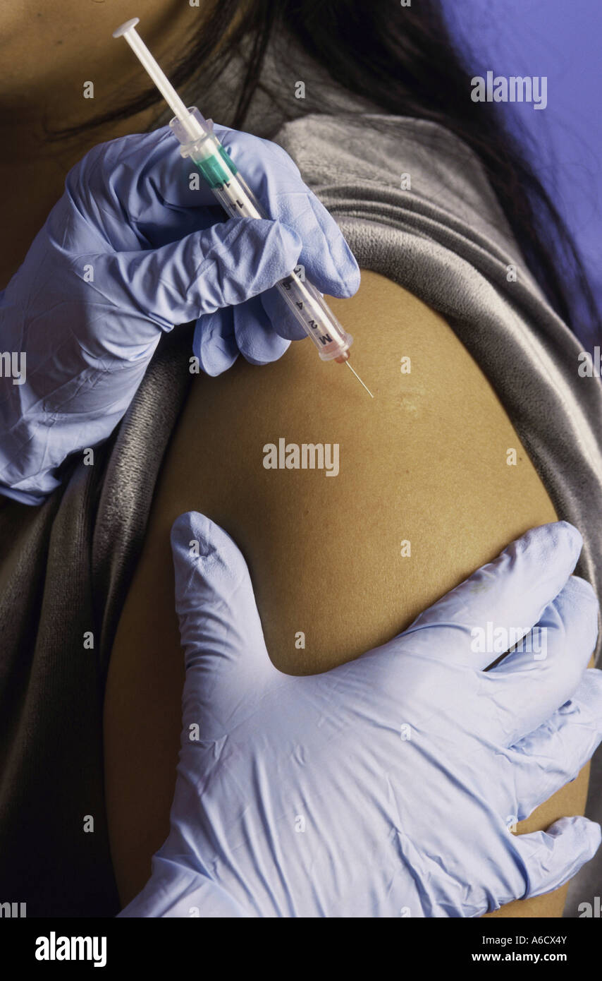 Person getting an injection Stock Photo - Alamy