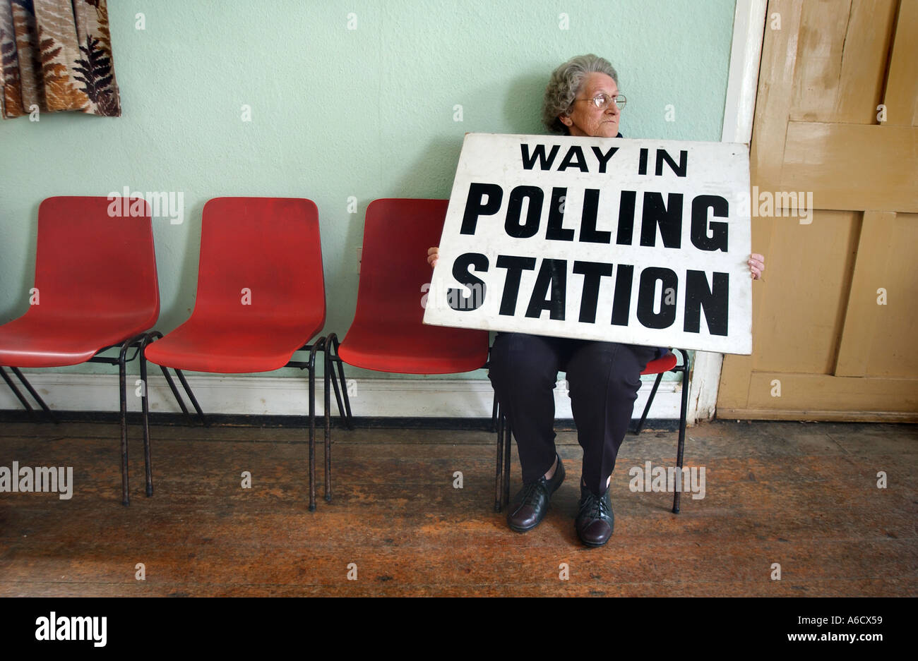 an elderly woman sat in an empty polling station in a village Stock ...