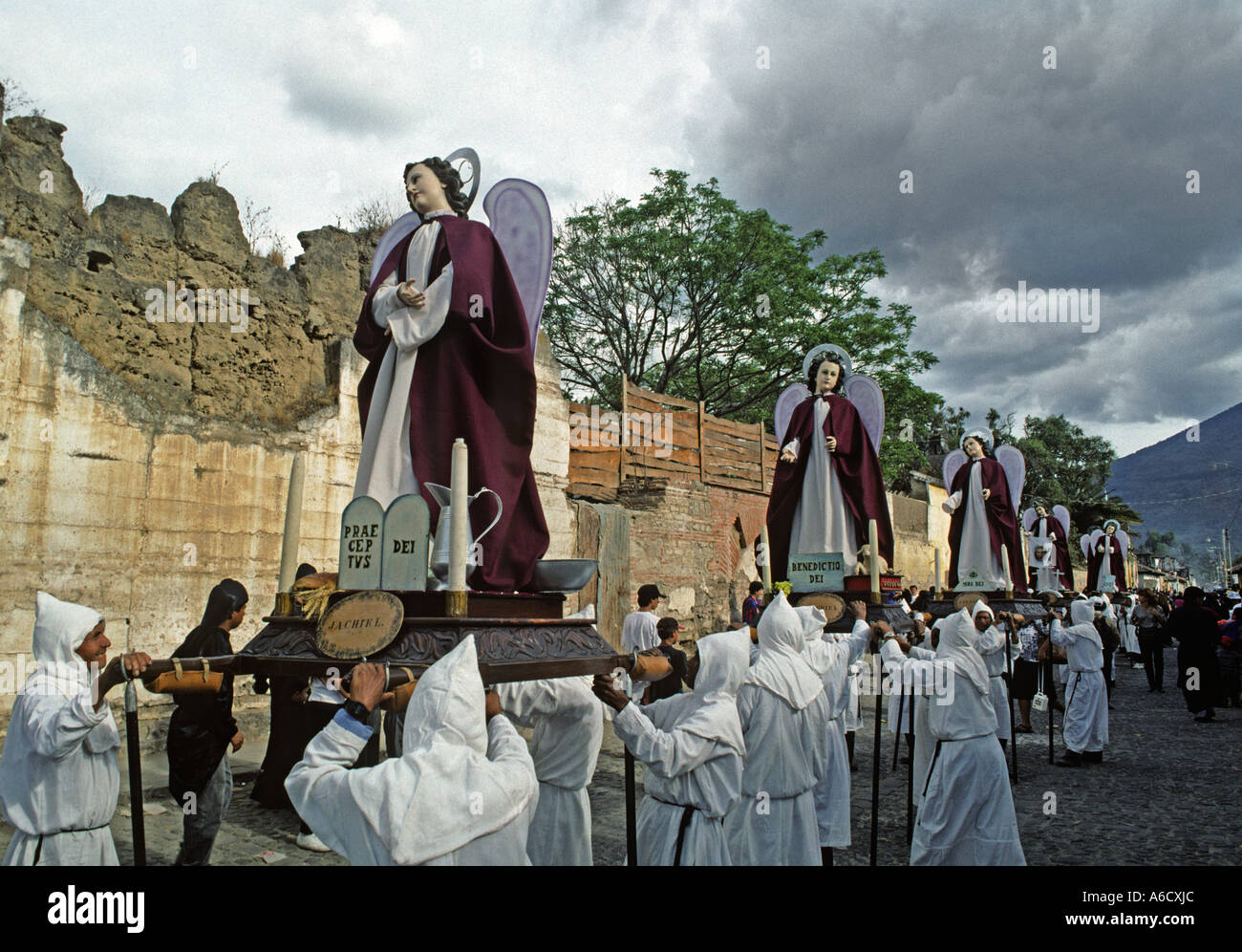 Participants carrying ANDAS CATHOLIC wooden floats of ANGELS during ...