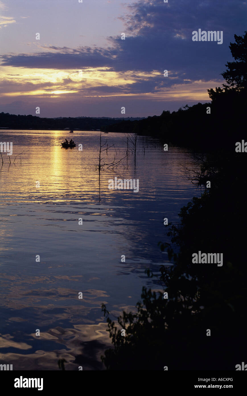 Sunset over water Stock Photo - Alamy