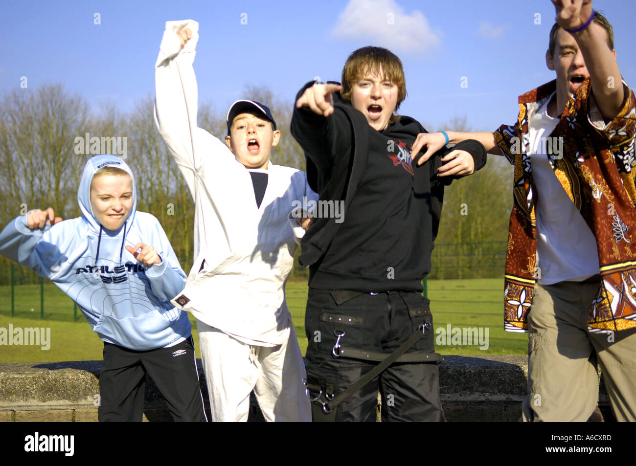 kids jump males boys lads children four gang friendship friends Stock ...