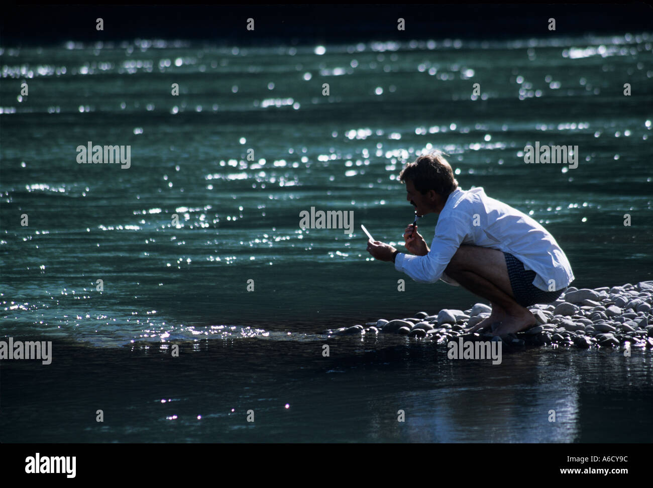 Canada Northwest Territories Peel River Peel River Canyon Man shaving ...