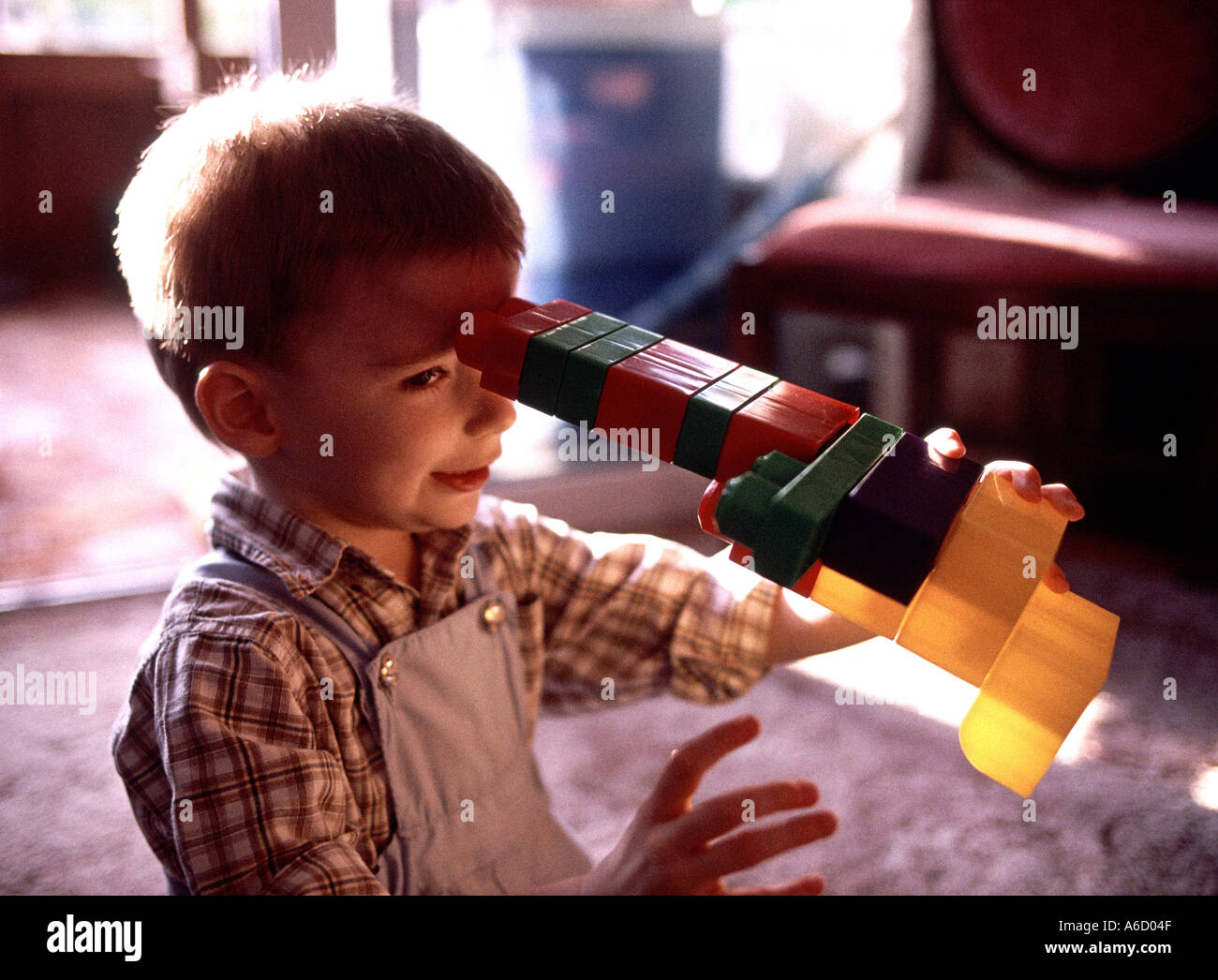 Child playing with building bricks Stock Photo - Alamy