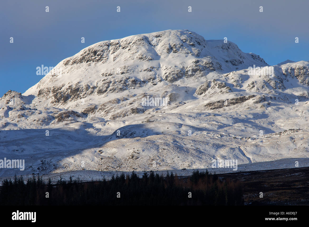 Meall Garbh in the snow covered Tarmachan hills under a bright blue sky ...