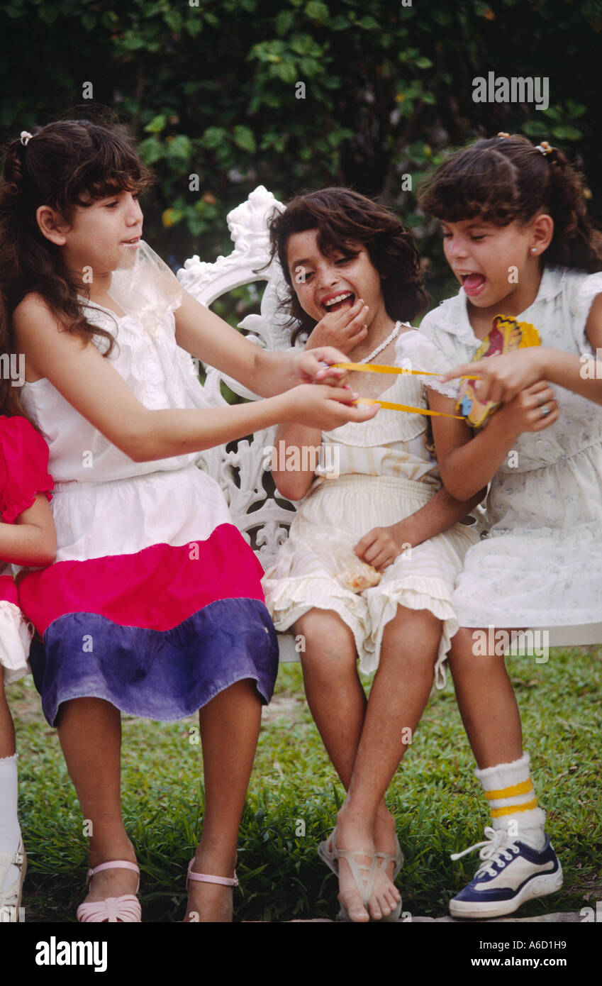 MEXICAN CHILDREN sitting on bench PUERTO VALLARTA MEXICO Stock Photo ...