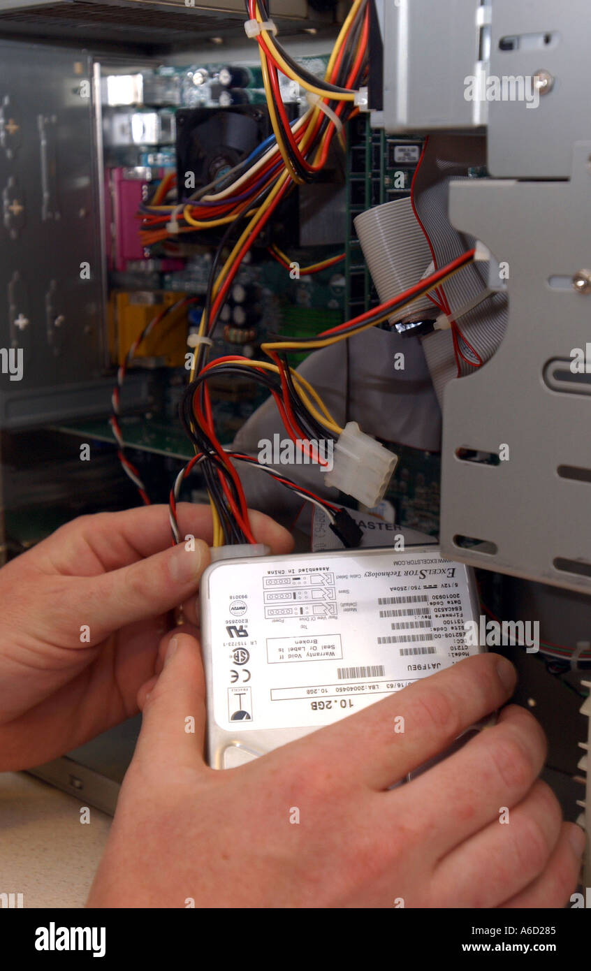 Removal of a computer hard drive Stock Photo - Alamy