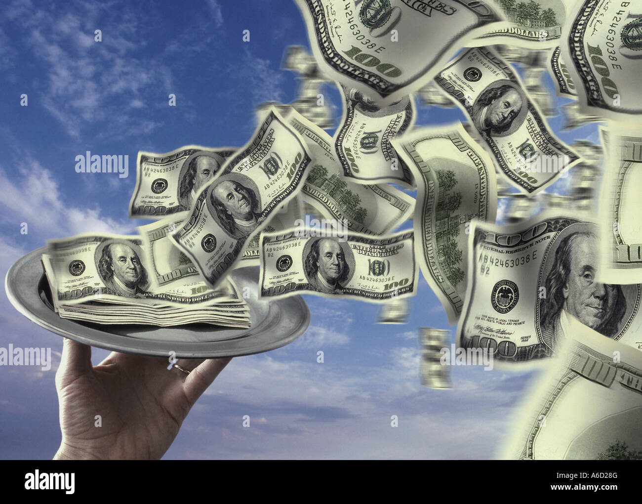Person holding a plate with US paper money Stock Photo - Alamy